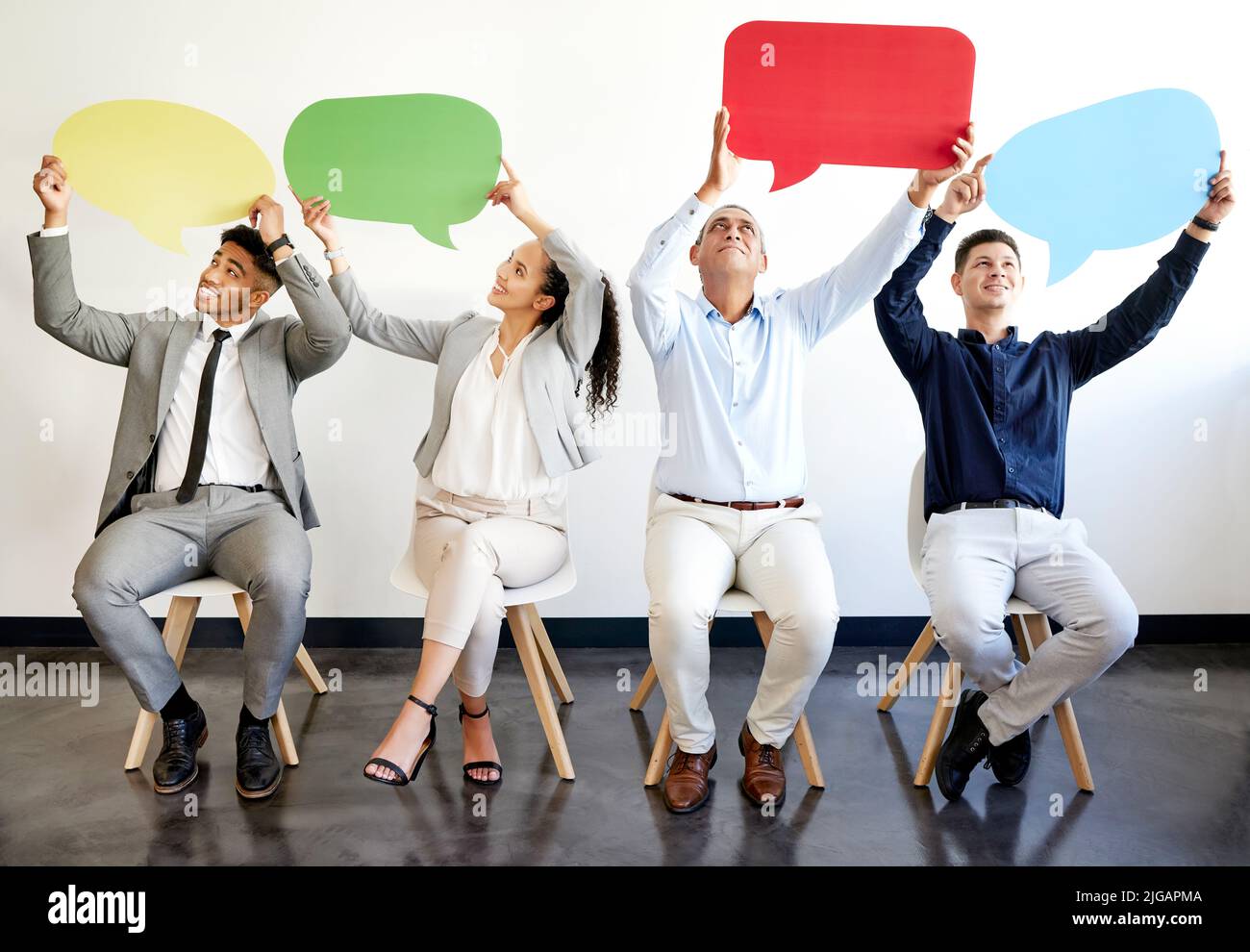 These are our thoughts. a group of businesspeople holding speech ...