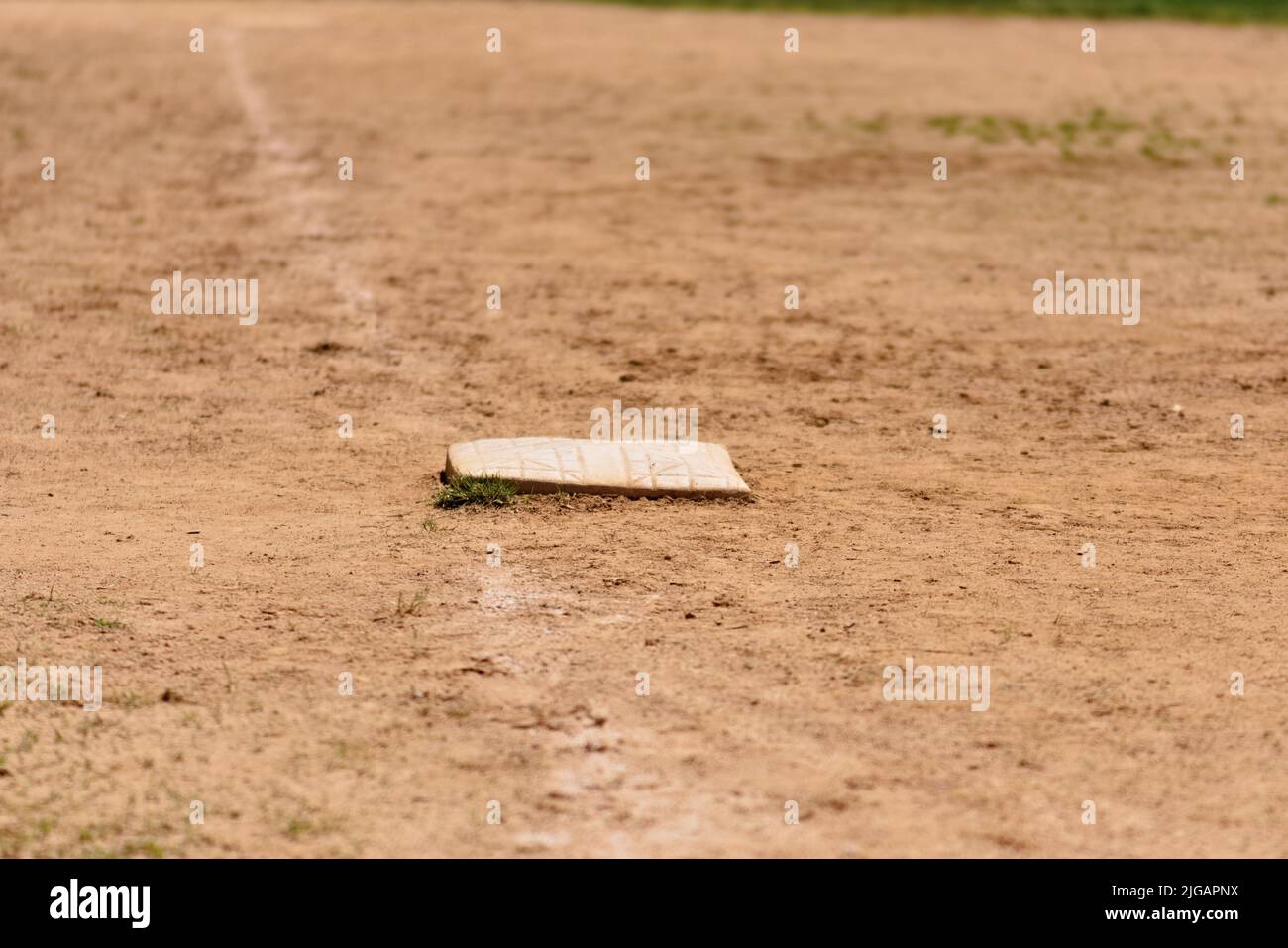 A selective focus shot of first base on a baseball field in Huntingdon ...
