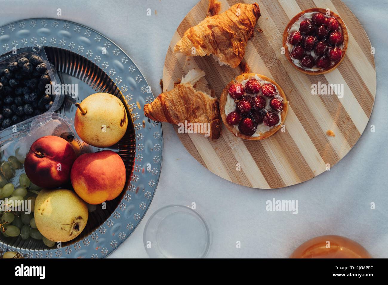 Flat Lay of Picnic Set, Fruits and Cakes with Croissants Laid Up on the ...