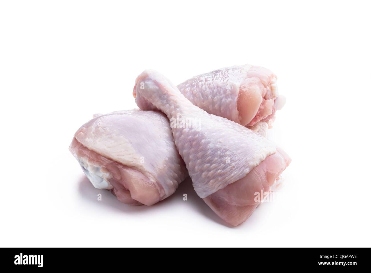 Raw chicken legs isolated on white Stock Photo - Alamy