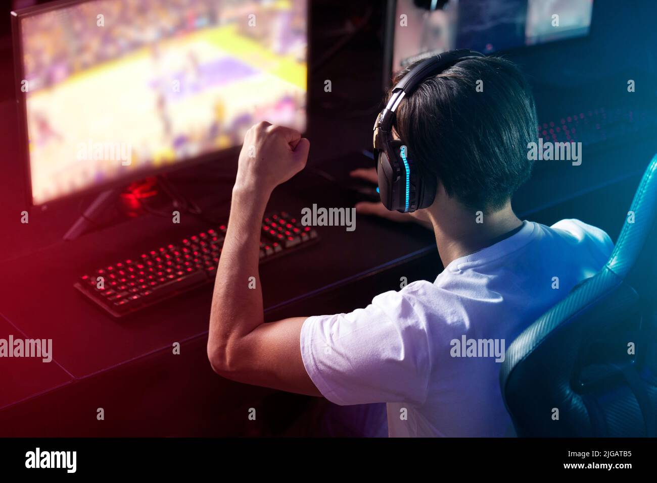 I came, I saw, I conquered. a young man cheering while playing computer ...