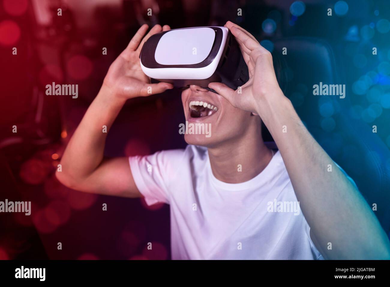 A bit of fantasy, a whole lot of fun. a young man using 3d goggles ...