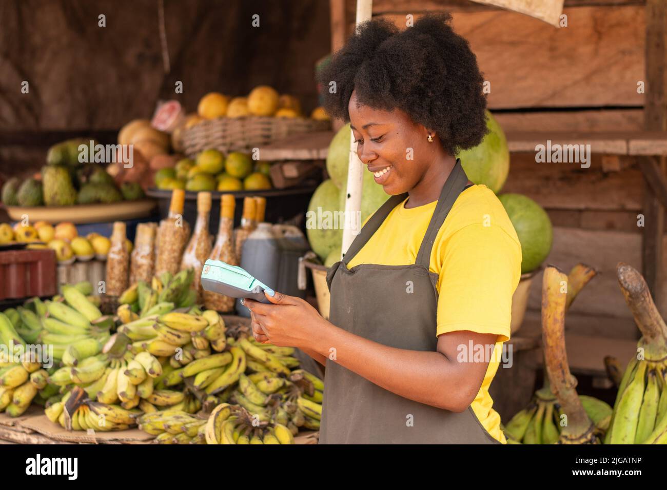 african market woman using a pos device and a credit card Stock Photo ...