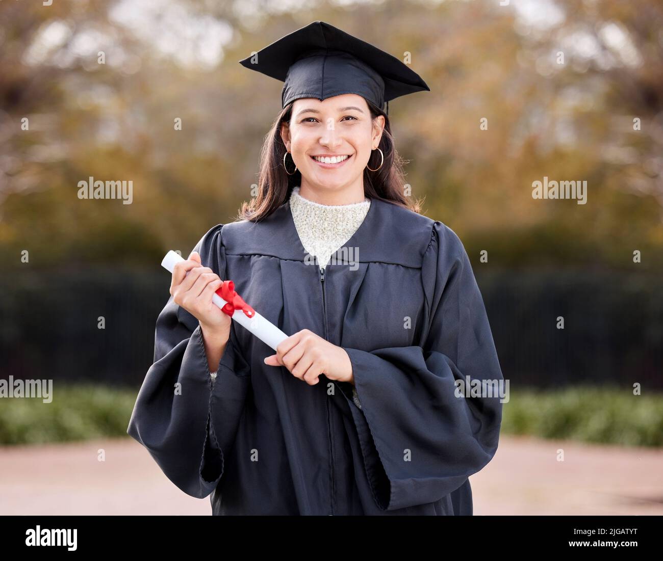 On my way to great places. Portrait of a young woman holding her ...