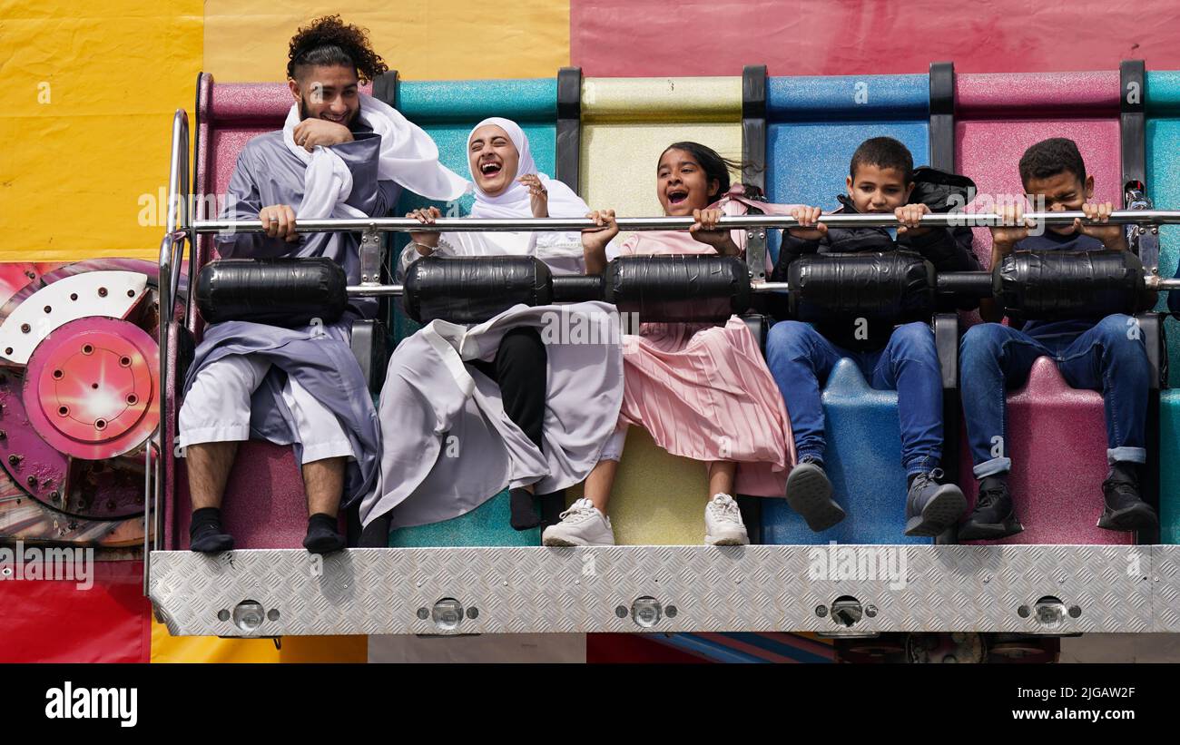 People enjoy a funfair at Small Heath park in Birmingham, for Eid al ...
