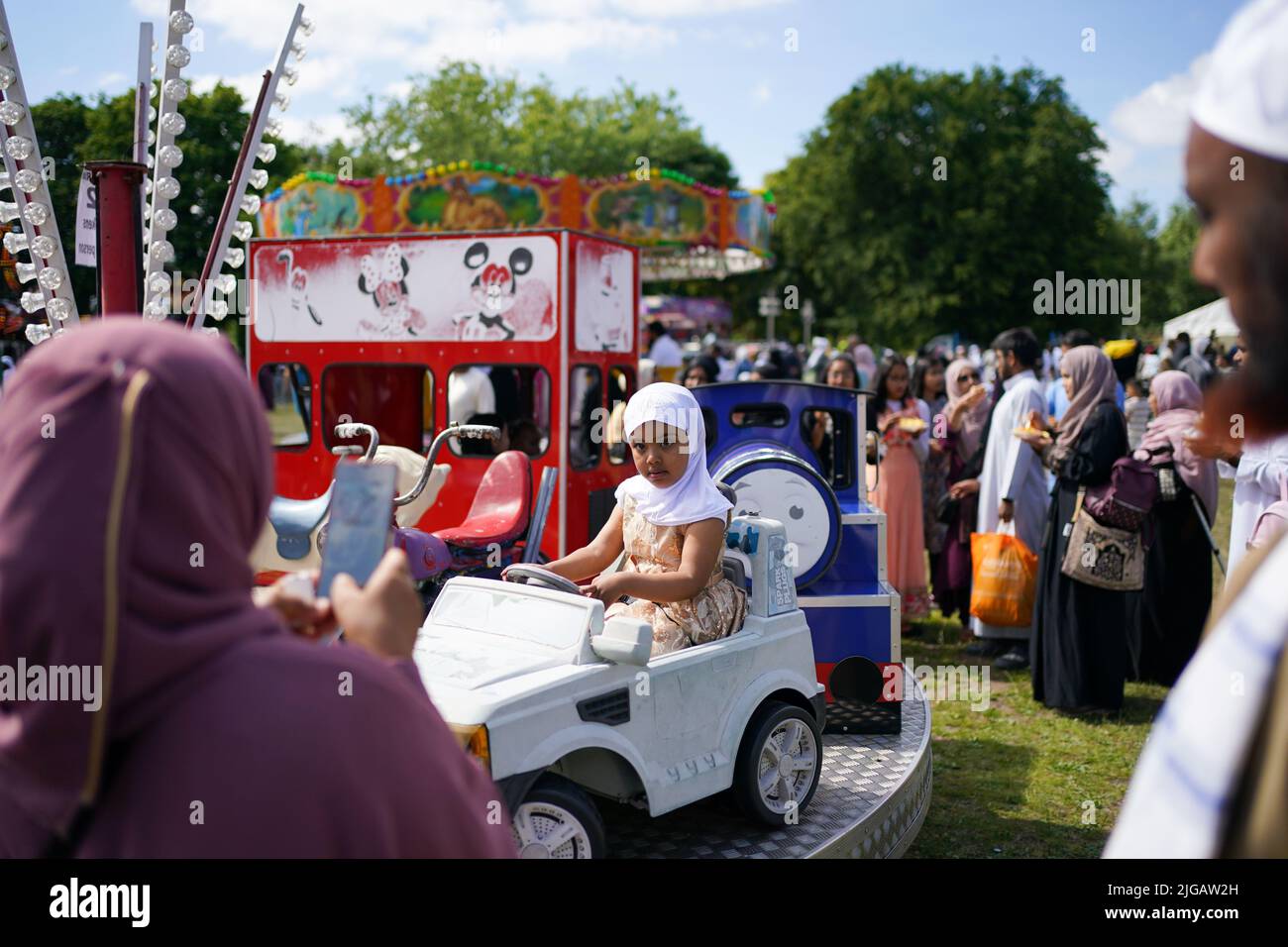 People enjoy a funfair at Small Heath park in Birmingham, for Eid al ...