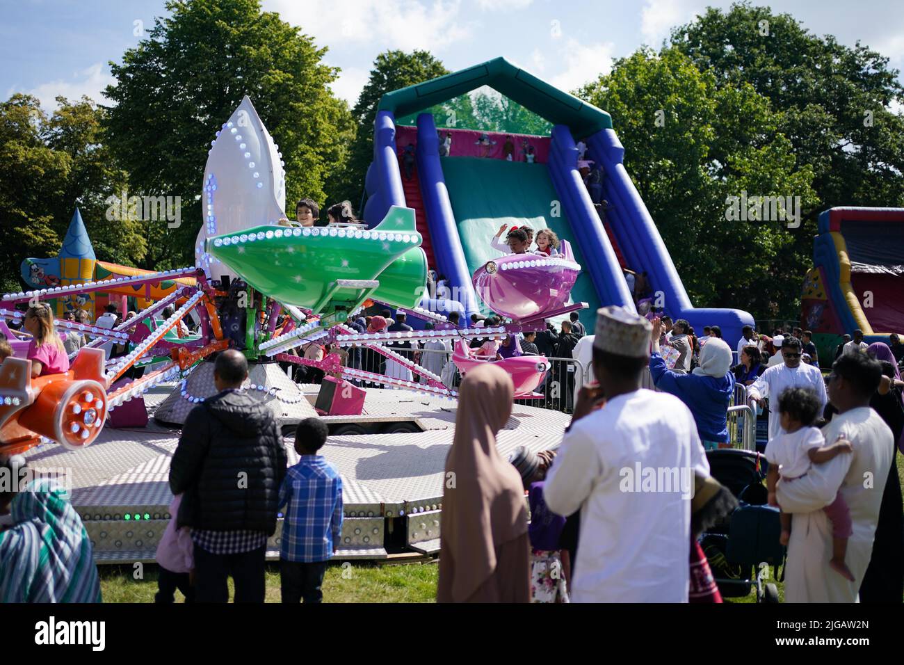 People enjoy a funfair at Small Heath park in Birmingham, for Eid al ...