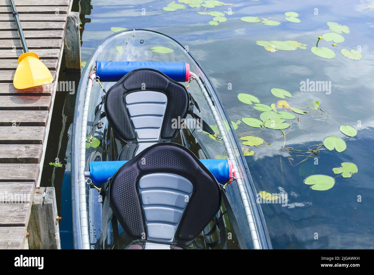 landscape with a transparent plastic boat, exploring a wild lake ...