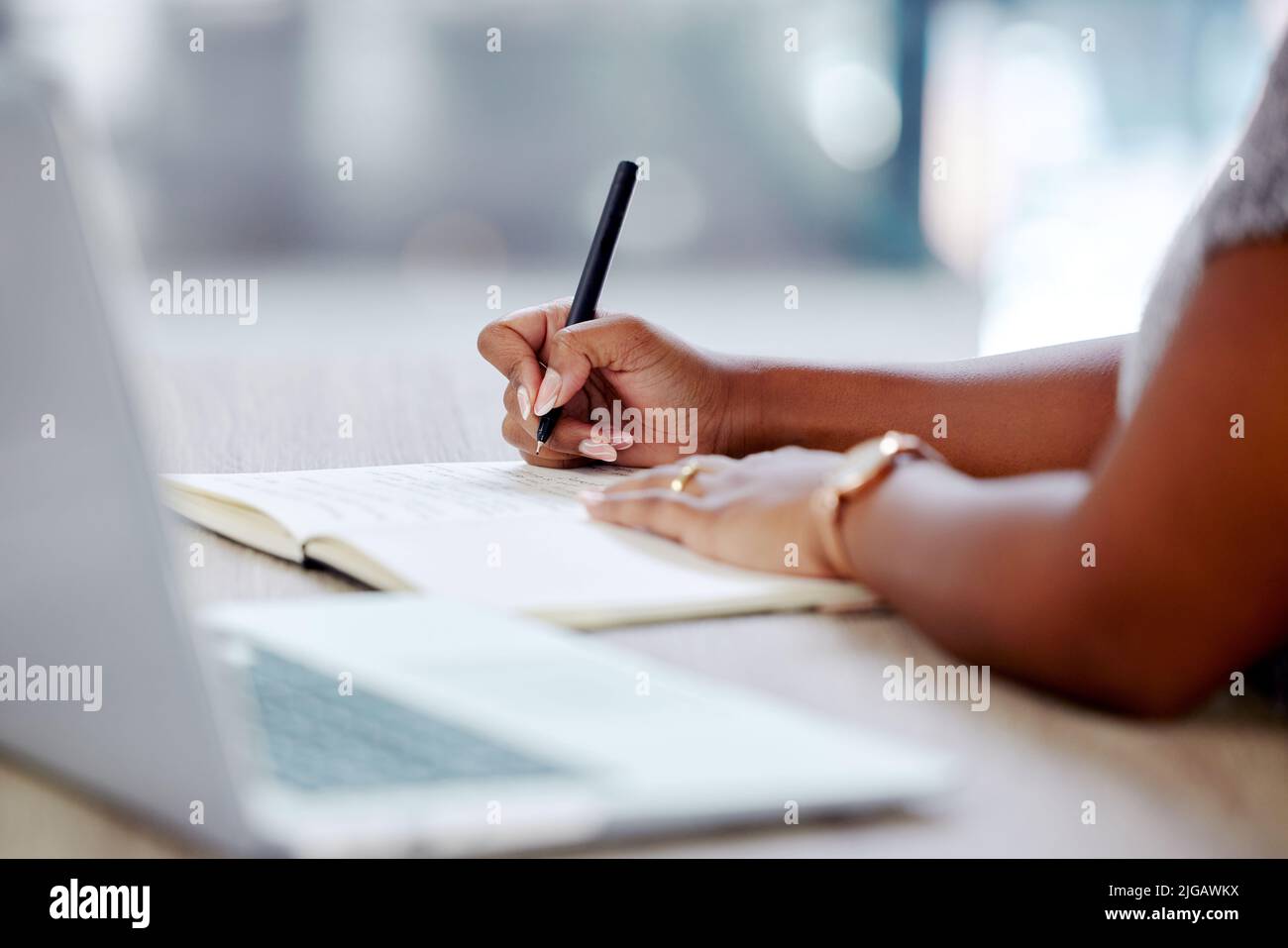Businesswoman working on laptop writing hi-res stock photography and ...