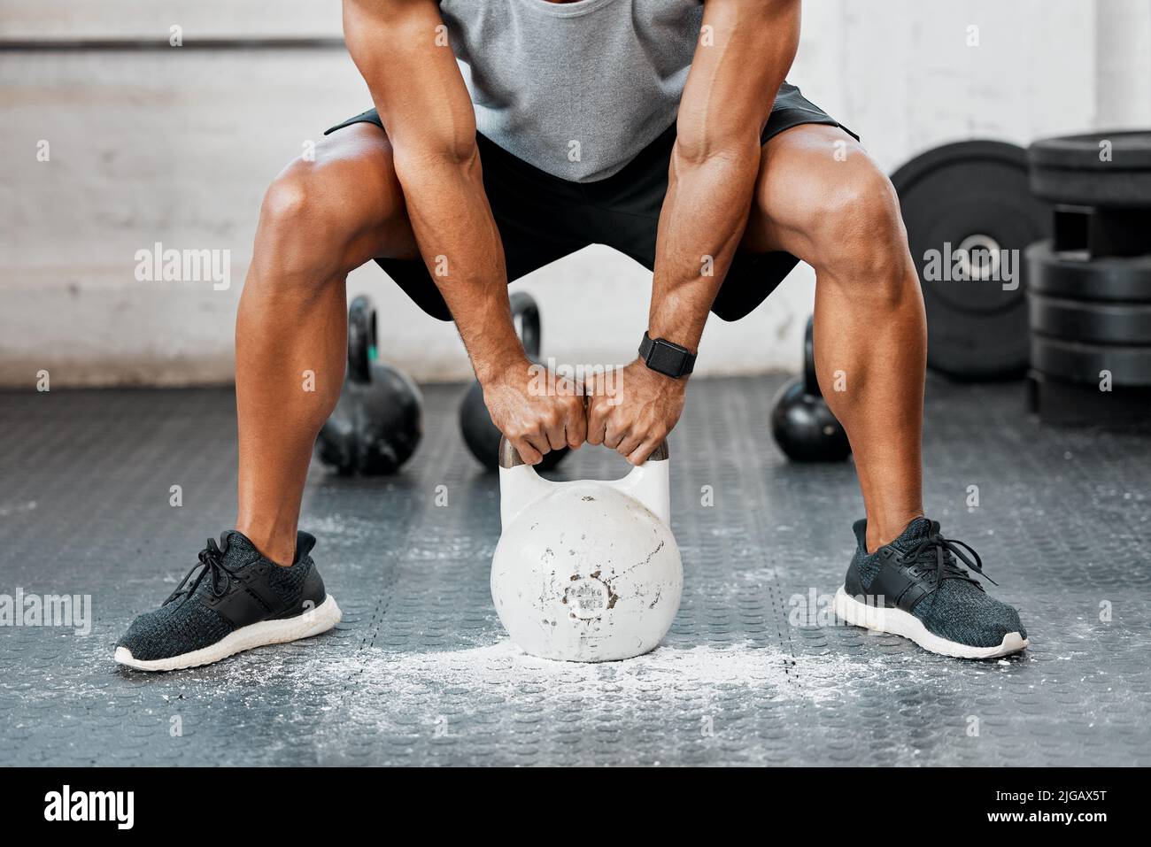 Fighting my way to a fitter form. a man completing squats with a ...