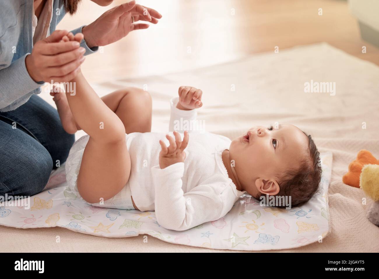 Changing diaper floor hi-res stock photography and images - Alamy