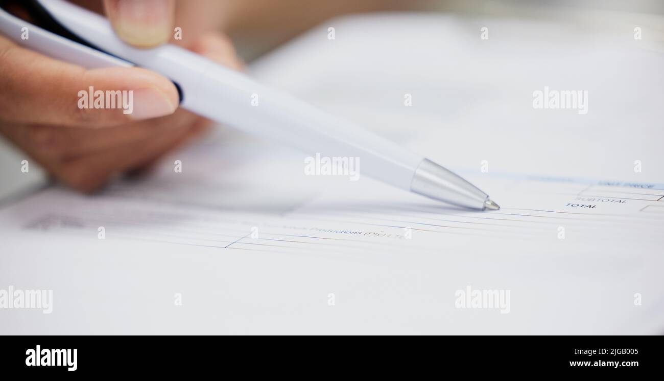 Read carefully. an unrecognizable woman filling in a form on a desk in ...