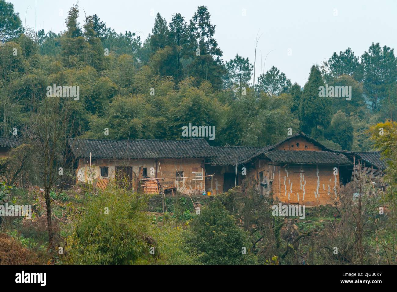 An old village house in the forest Stock Photo - Alamy
