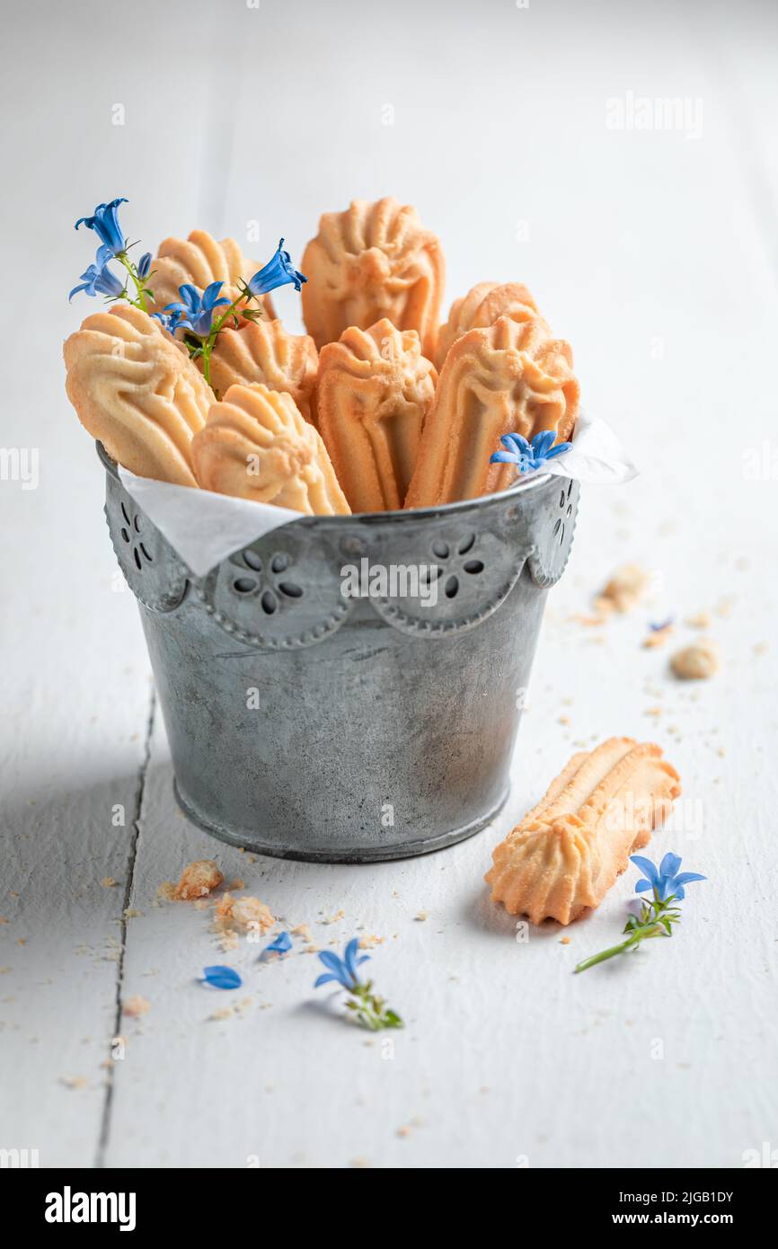Homemade and sweet tongues cookies in old metal bucket. Shortbread ...