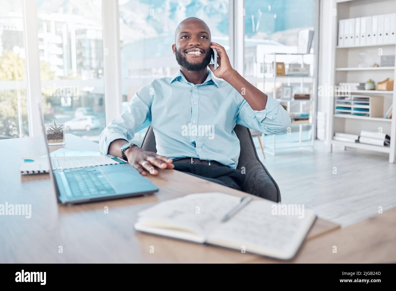 That meeting sounds great. a young businessman using his smartphone to ...