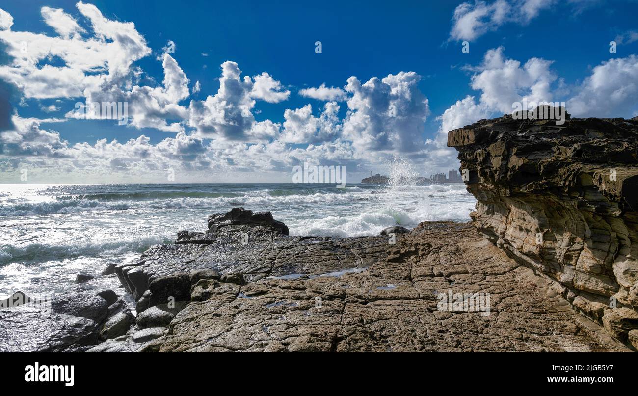 An aerial view of rocky beach in background of sea in Queensland Stock ...