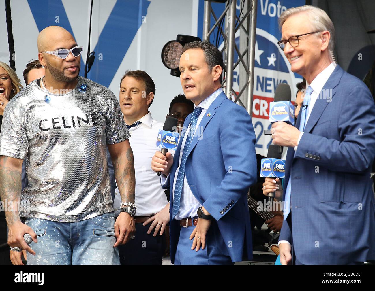 New York, NY, USA. 8th July, 2022. Flo Rida, Brian Kilmeade, Steve Doocy, pictured as Flo Rida ...
