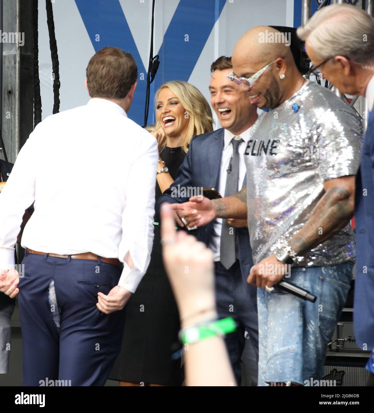 New York, NY, USA. 8th July, 2022. Todd Piro, Ainsley Earhardt and Flo Rida pictured as Flo Rida ...