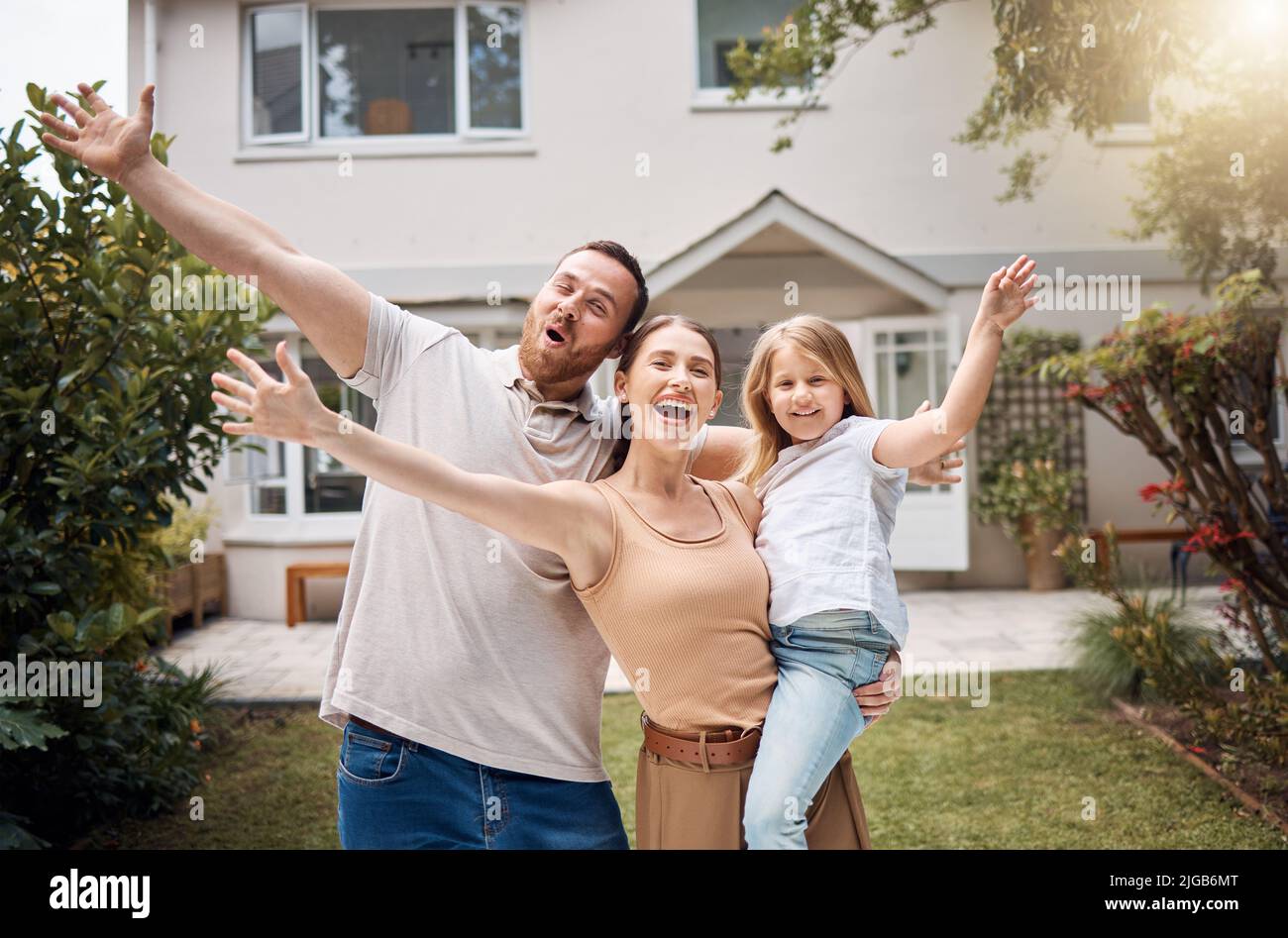 Welcome to our home. a young couple standing outside and posing with ...