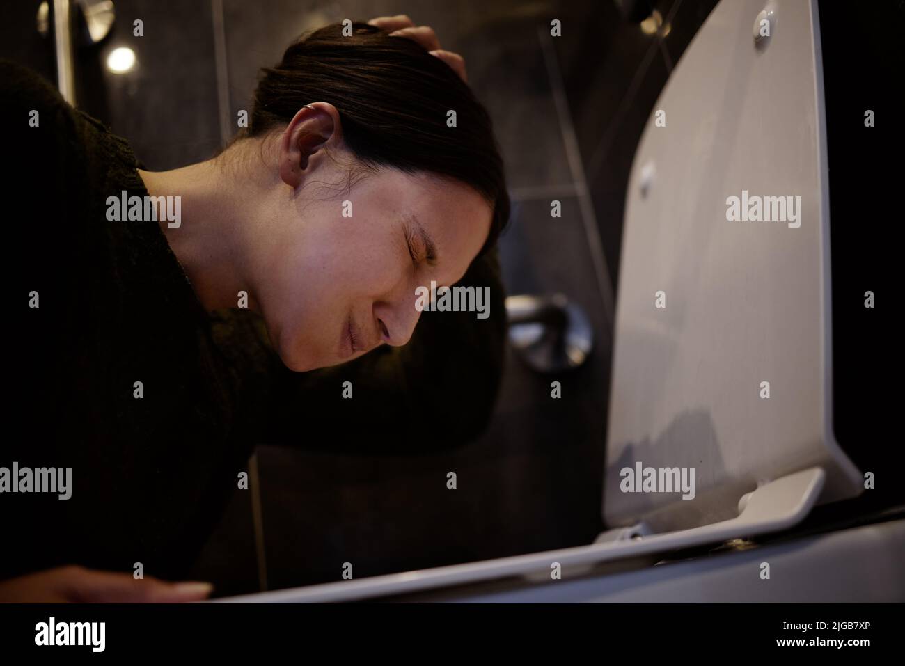 I cant hold it in anymore. an attractive young woman crouching by the ...