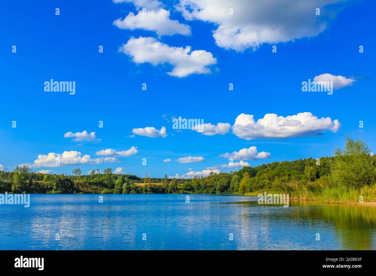 Beautiful quarry lake dredging pond lake with blue turquoise water blue ...
