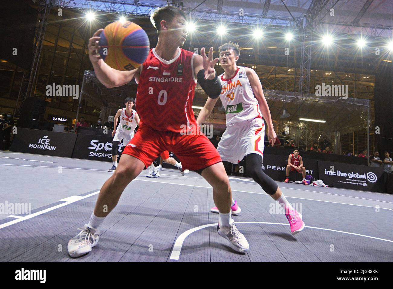 Singapore. 9th July, 2022. Lim Jun Yuan (L) of Singapore shields the ...
