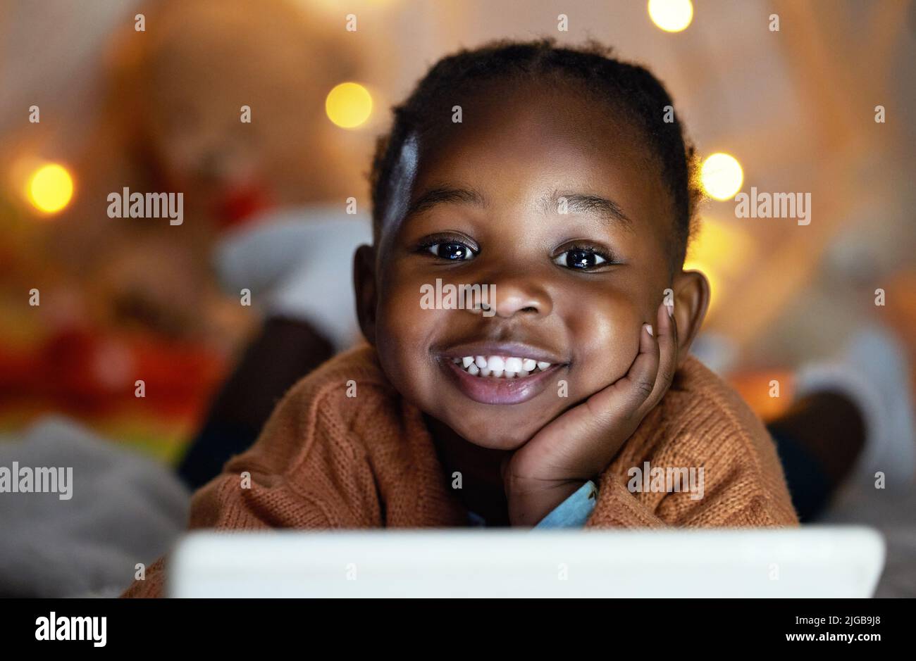 Whats your favourite bedtime story. an adorable little girl using a ...