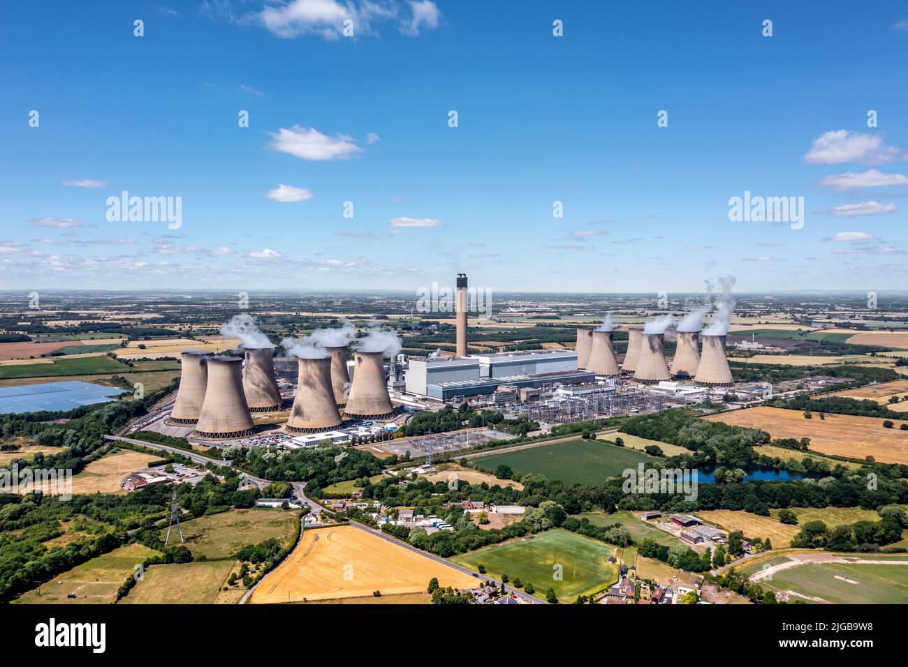 Aerial landscape view of Drax Power Station in North Yorkshire with smoking chimneys and cooling ...