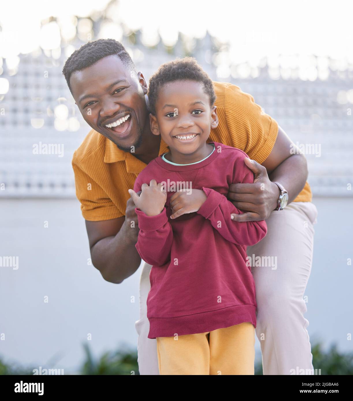 Happy fathers raise happy kids. an adorable little boy embracing his ...