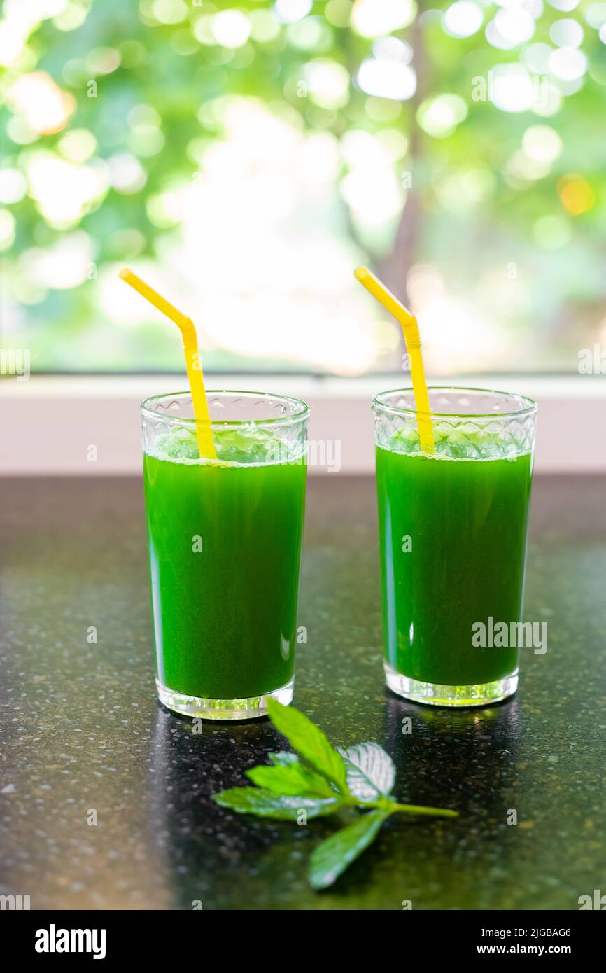 A green drink made from fresh vegetable greens with chlorophyll in ...