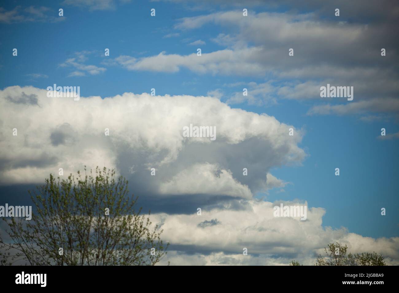Large cloud in sky. Details of spring sky. Air mass. Spring weather ...