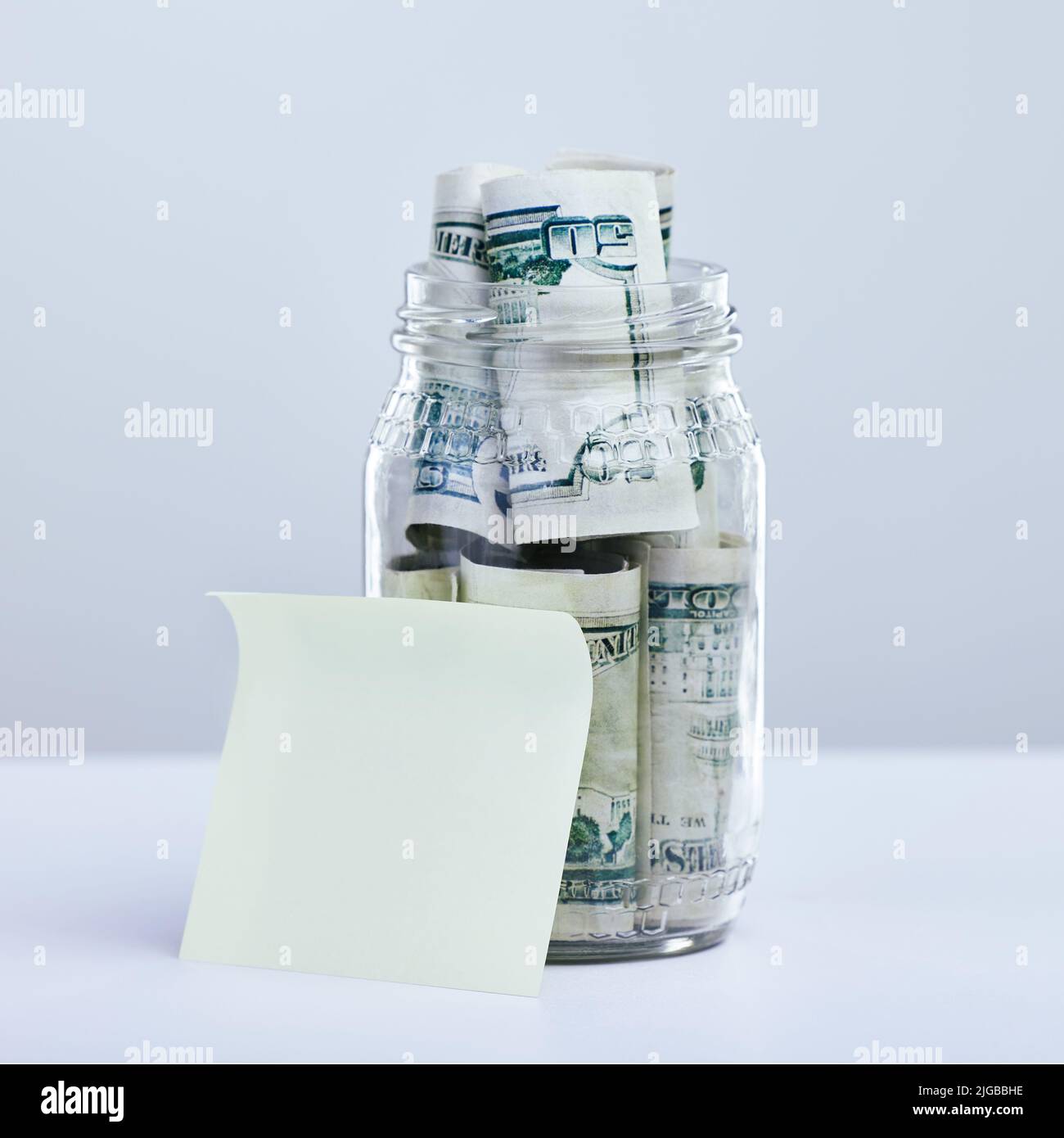 Save up, you dont know what lies ahead. a blank note and a jar filled ...