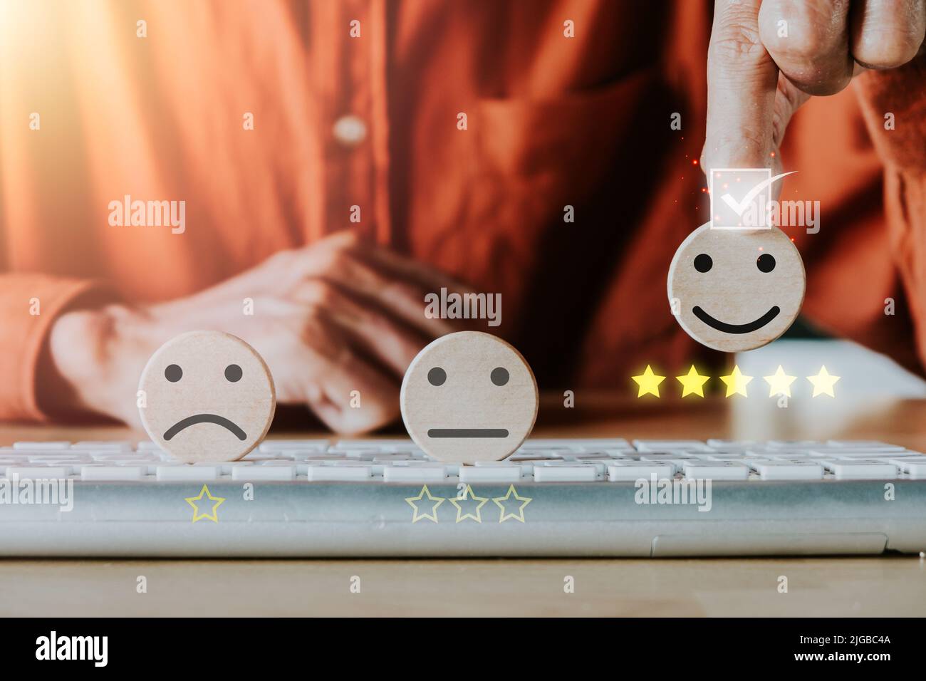 Businessman hand holding smiley face emoticon on virtual touch screen ...