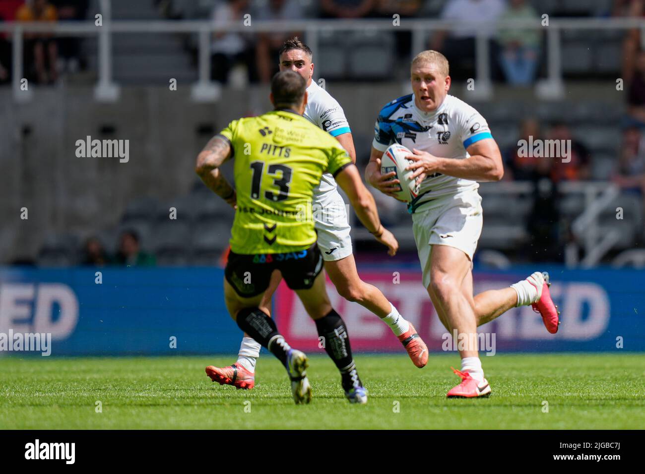 Nathan Peats #35 of Toulouse Olympique runs at Jay Pitts #13 of ...