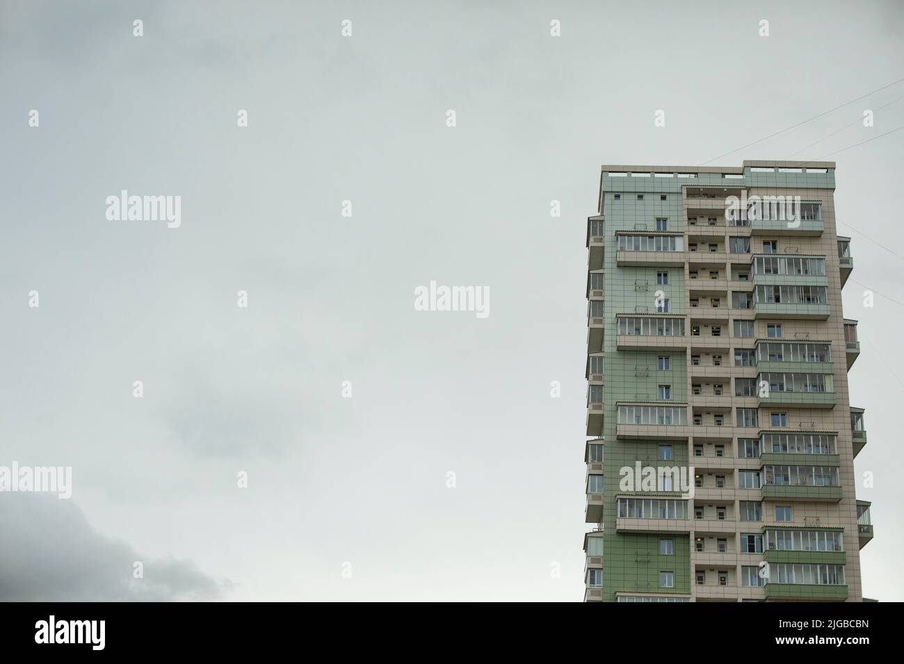 Residential building in city. Building is in bad weather. Many windows ...