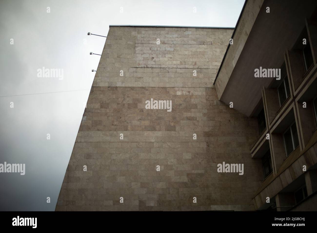 Building in city. Urban development. Architecture details. Wall of ...
