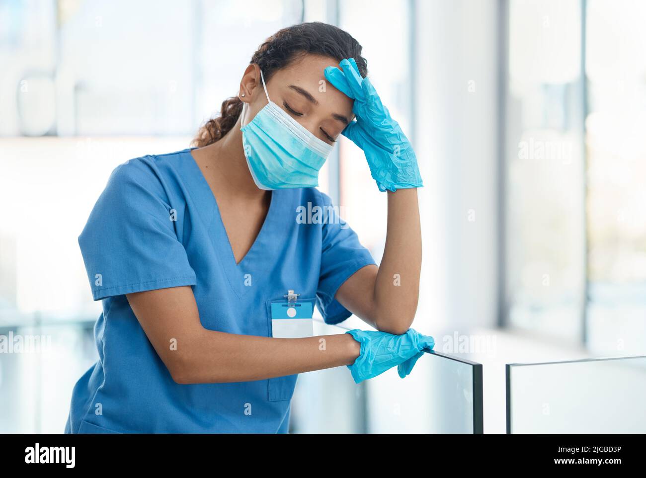 Constant attention by a good nurse. a female nurse looking stressed ...