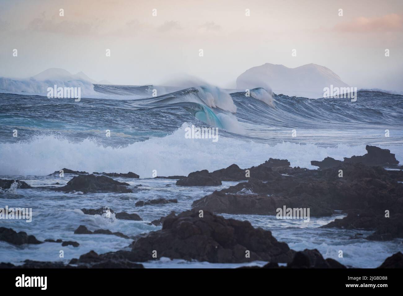 high ocean waves hitting on rocky coast Stock Photo - Alamy