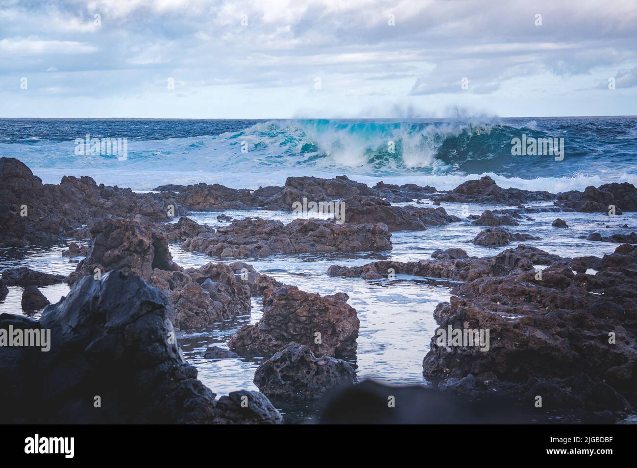 high ocean waves hitting on rocky coast Stock Photo - Alamy