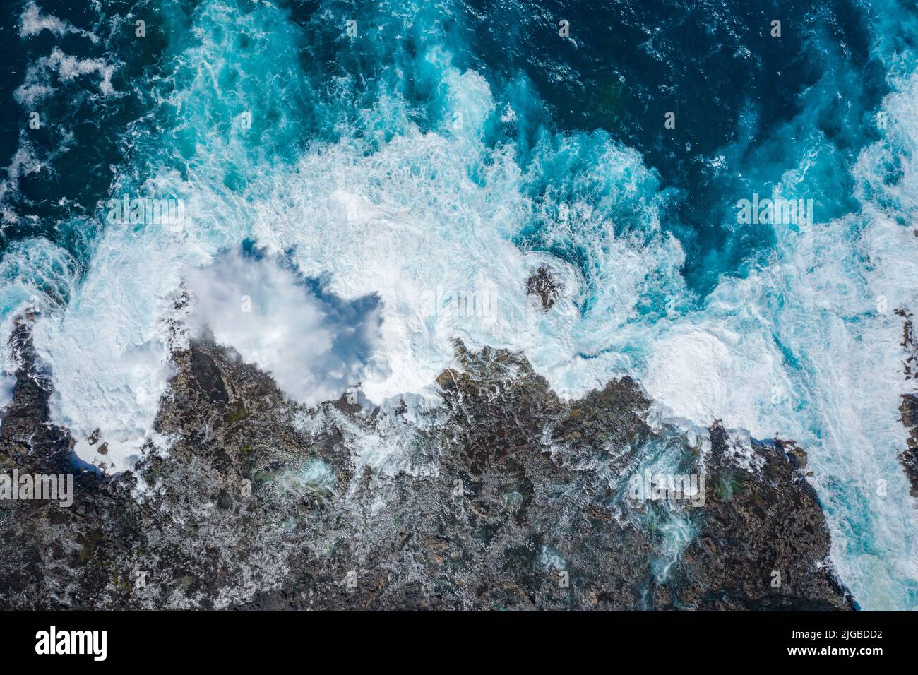 aerial view of ocean waves breaking on rocky coast Stock Photo - Alamy