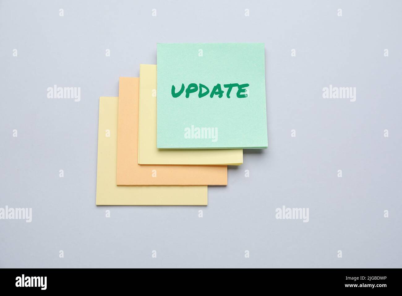Sticky notes on light background. Update concept Stock Photo - Alamy