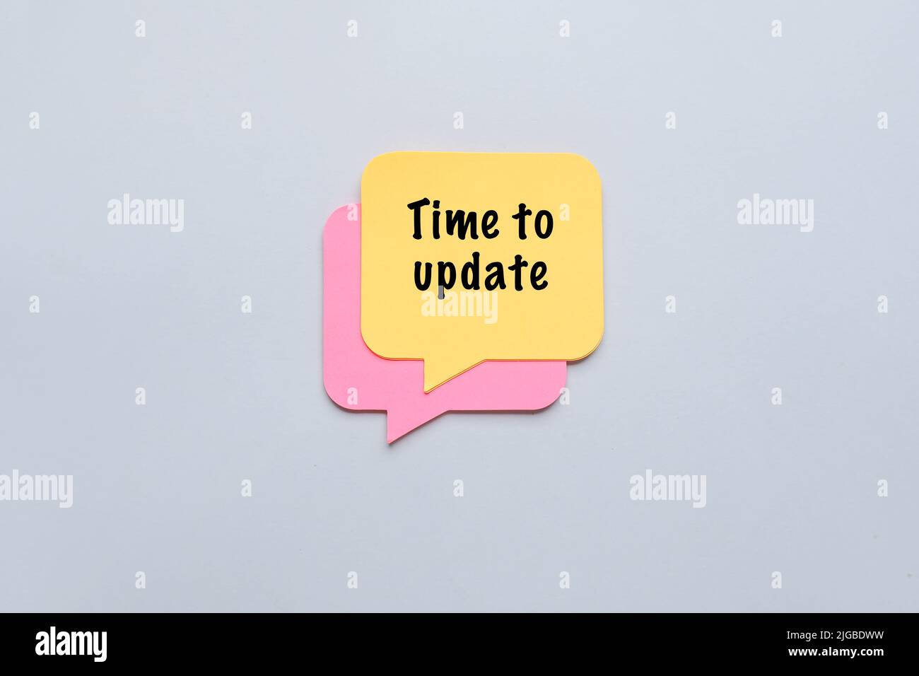 Sticky notes on grey background. Time to update Stock Photo - Alamy