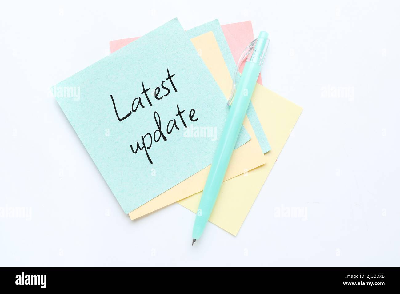 Sticky notes and pen on light background. Latest update Stock Photo - Alamy