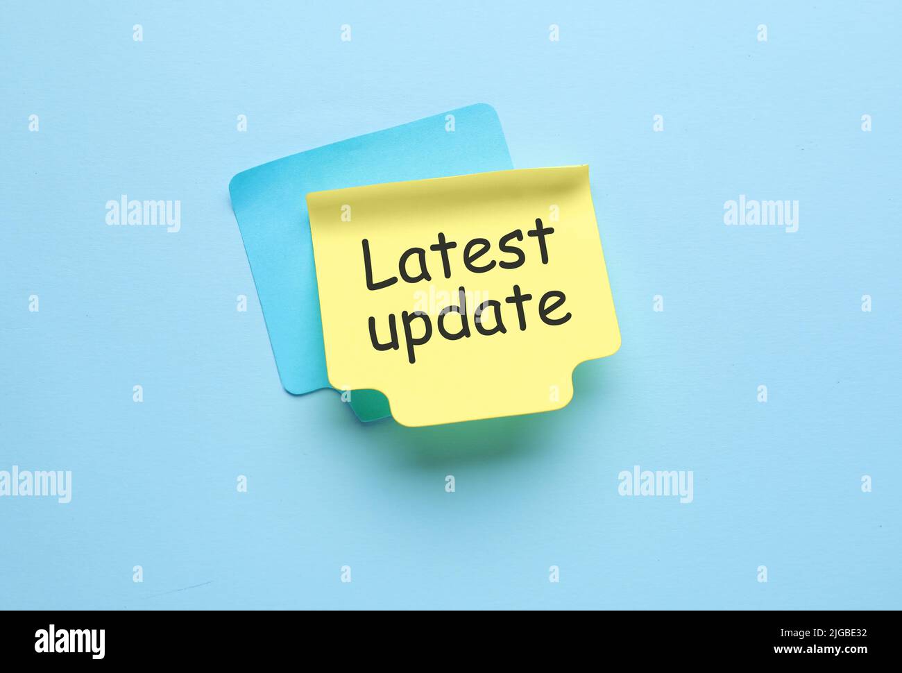 Sticky notes on light blue background. Latest update Stock Photo - Alamy