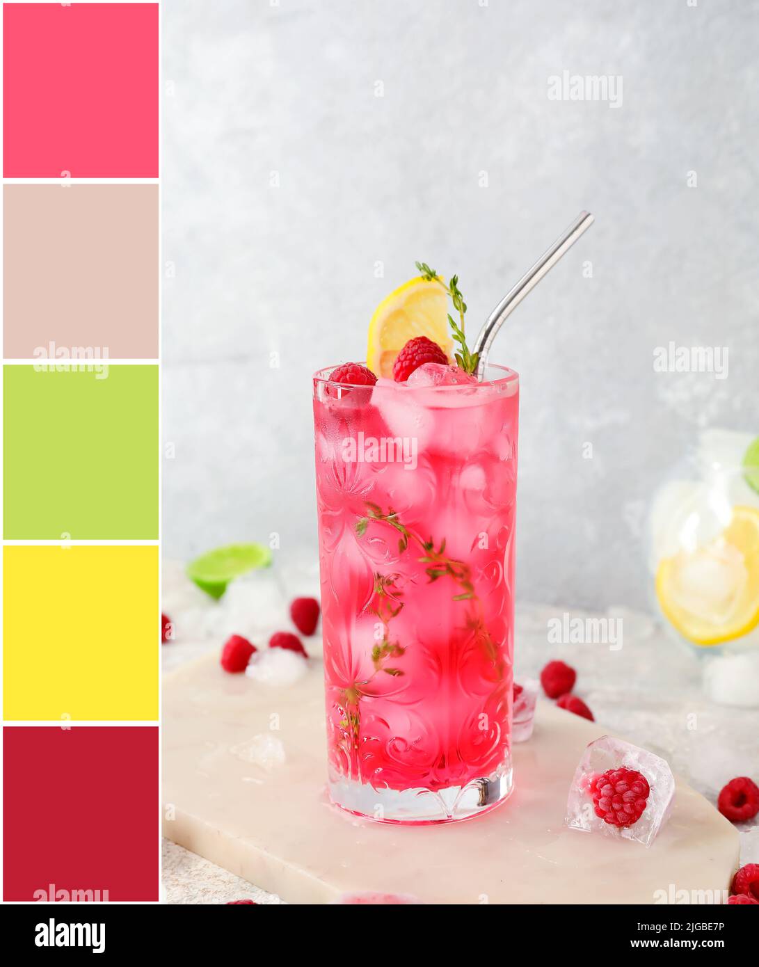 Glass of tasty raspberry lemonade on light background. Different color ...
