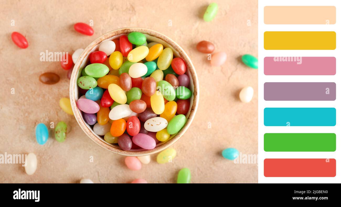 Bowl with sweet candies on beige background. Different color patterns ...