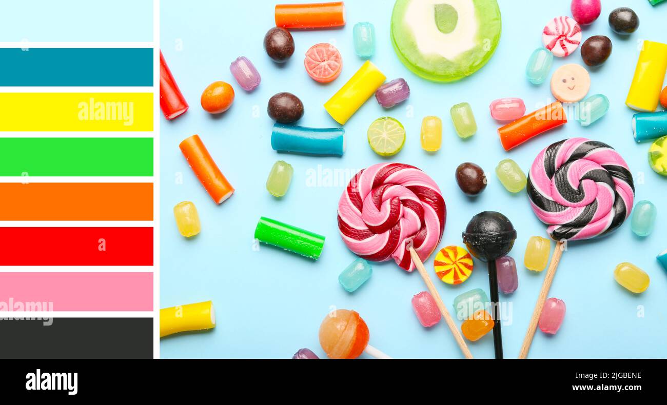 Assortment of sweet candies on light blue background. Different color ...
