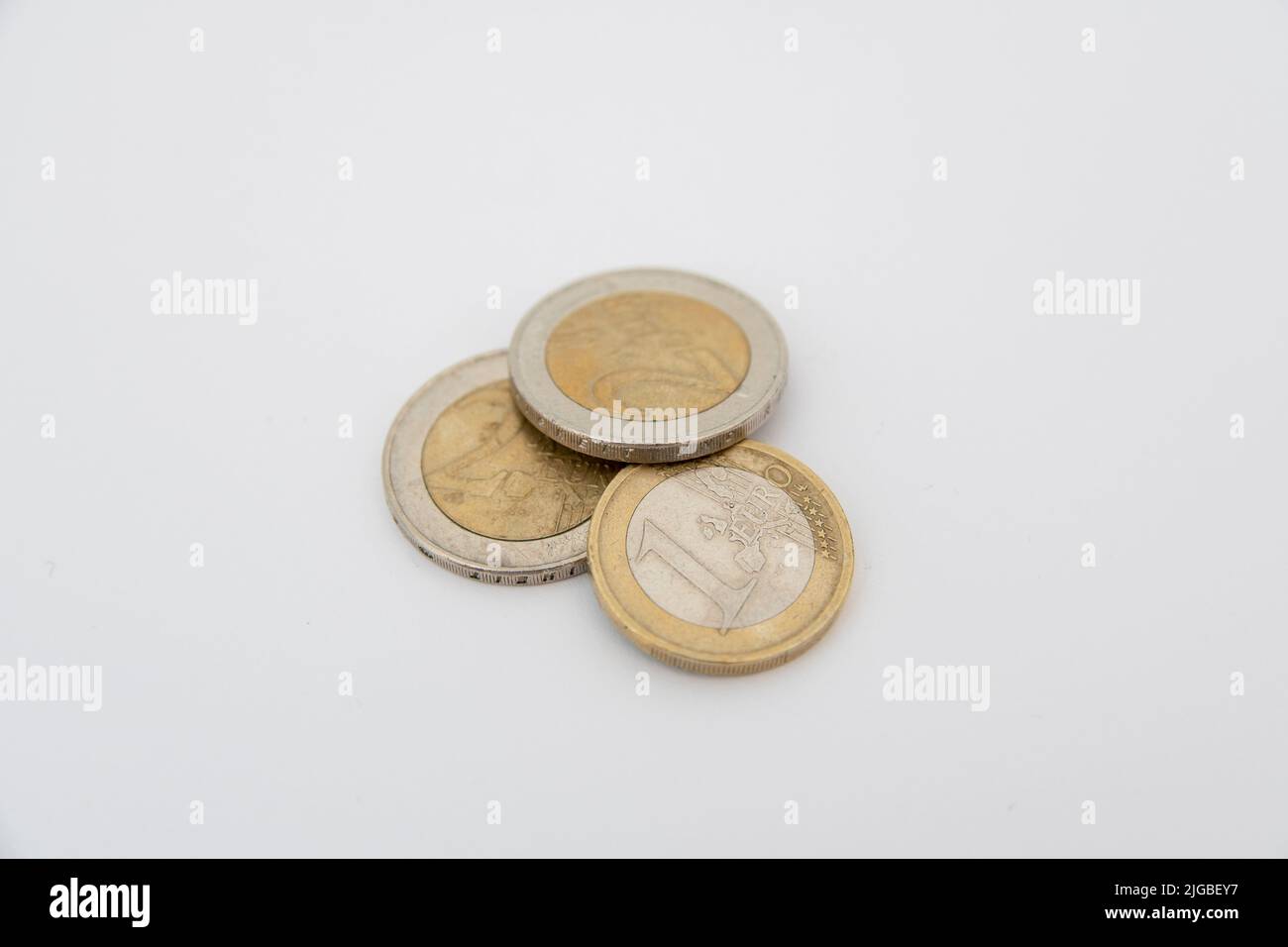 Euro coins lying on a white background Stock Photo - Alamy