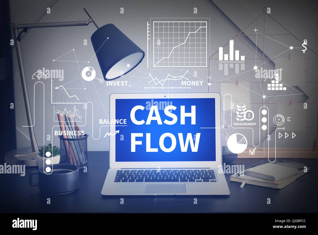 Modern laptop on office table. Cash flow Stock Photo - Alamy