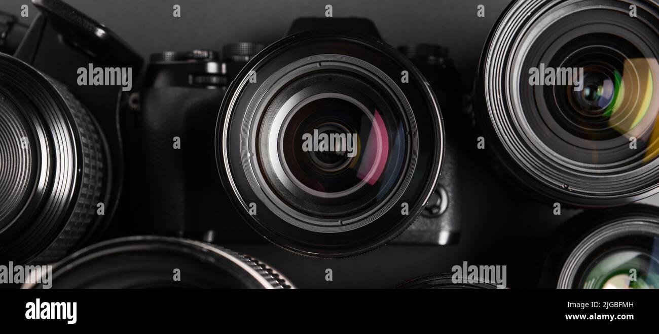 Different lenses for photo camera on dark background, top view Stock ...